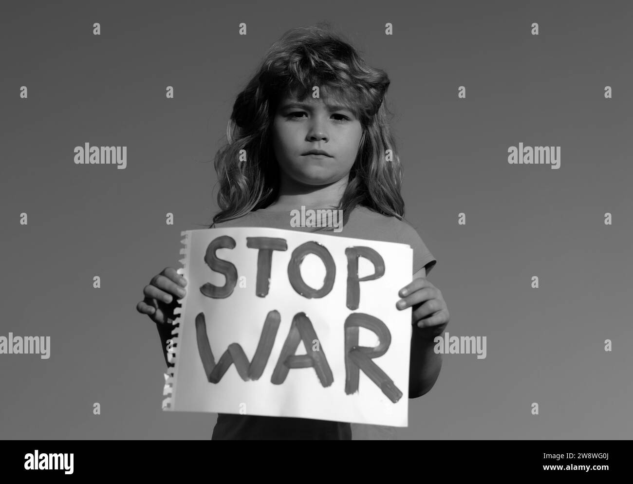 Child carries a sign Stop war. Portrait little boy calls to Stop war ...