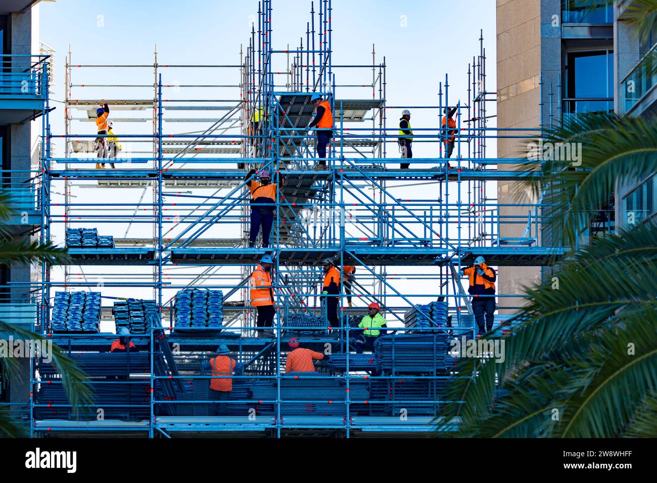Men in high vis clothing on a complex setup of light weight alloy ...