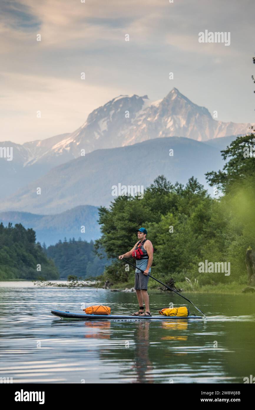 Paddle boarding the Squamish River below Mount Garibaldi, Squamish ...