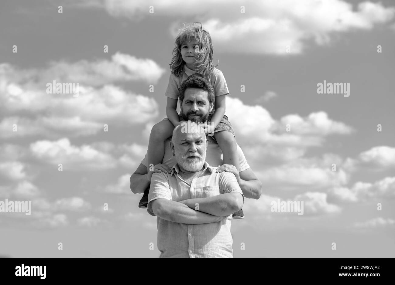 Portrait of men generation grandfather father and son outdoor. Fathers ...