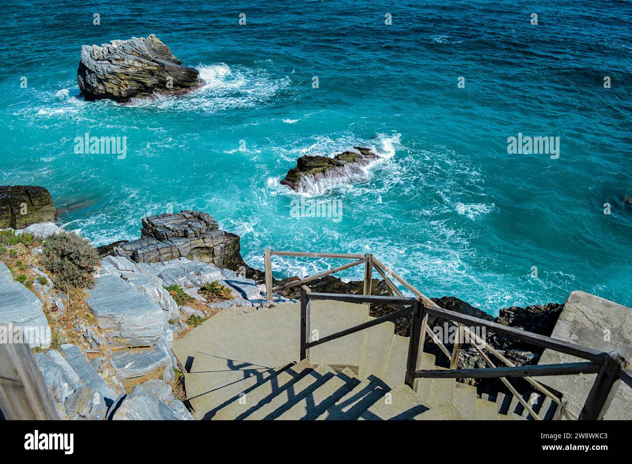Beach and blue sea with cliffs in Greece Stock Photo - Alamy