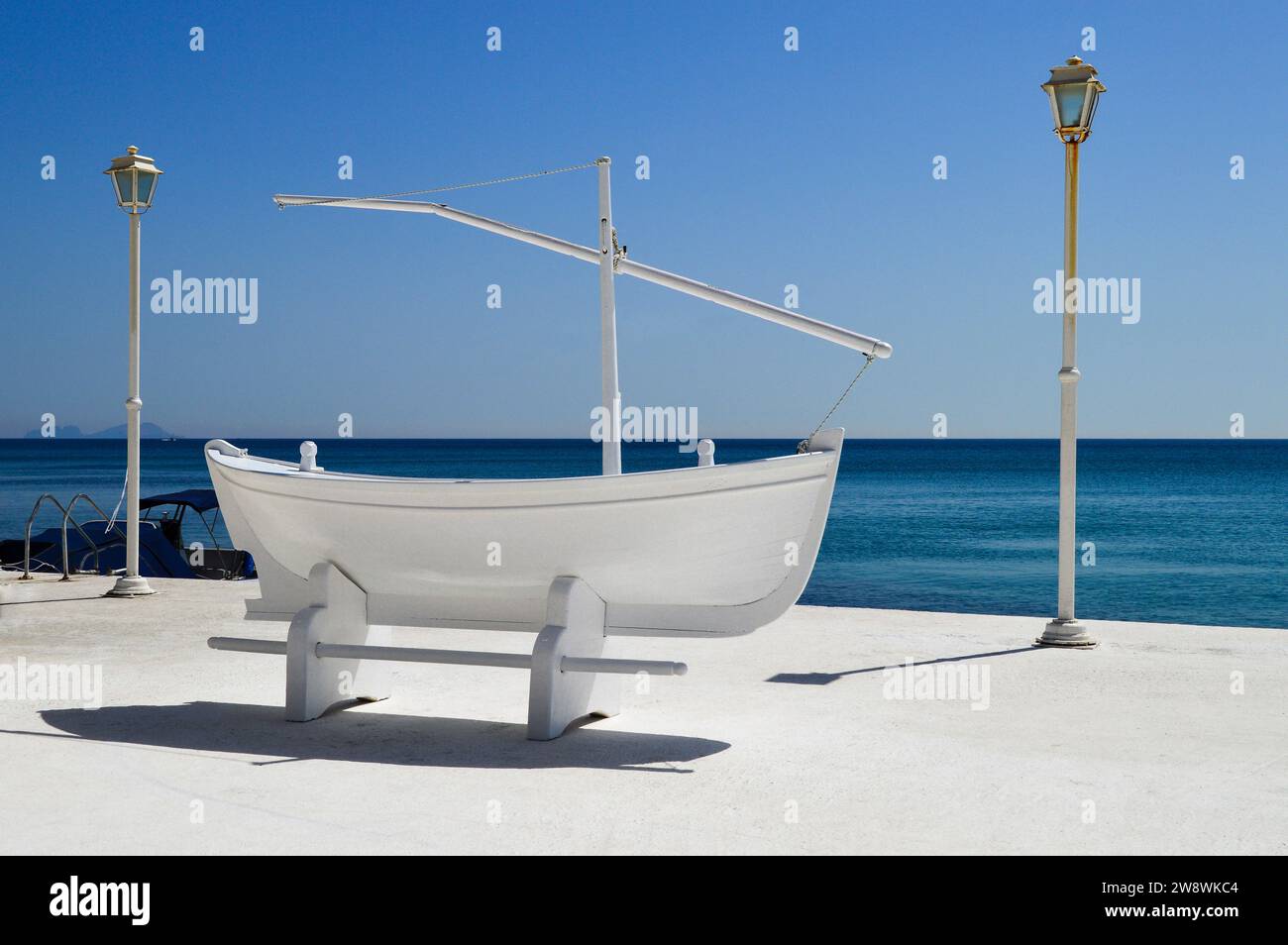 boat on the terrace of mykonos beach Stock Photo - Alamy