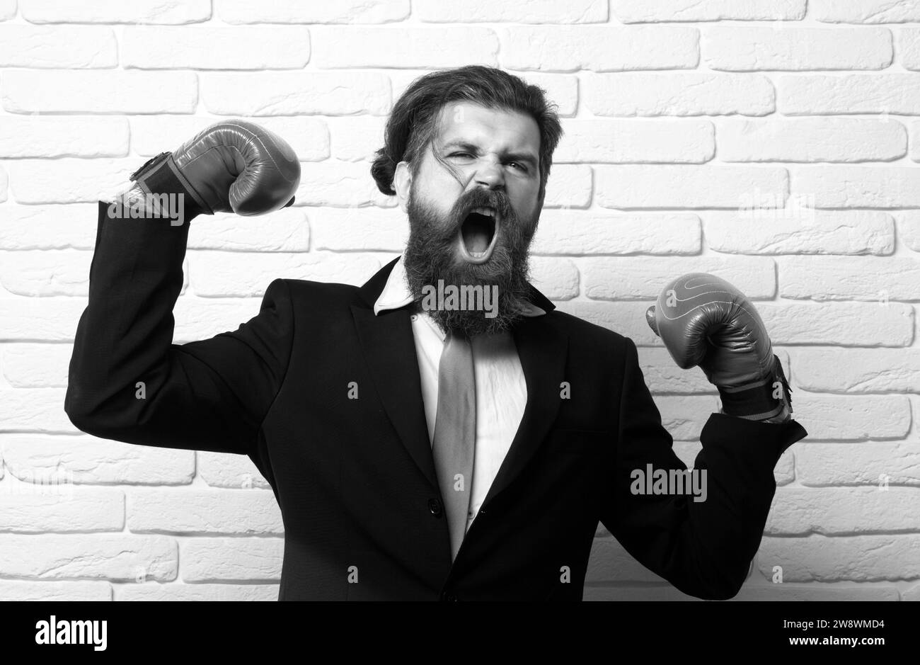 Crazy man boxing. Funny excited boxer businessman. Young man in a suit ...