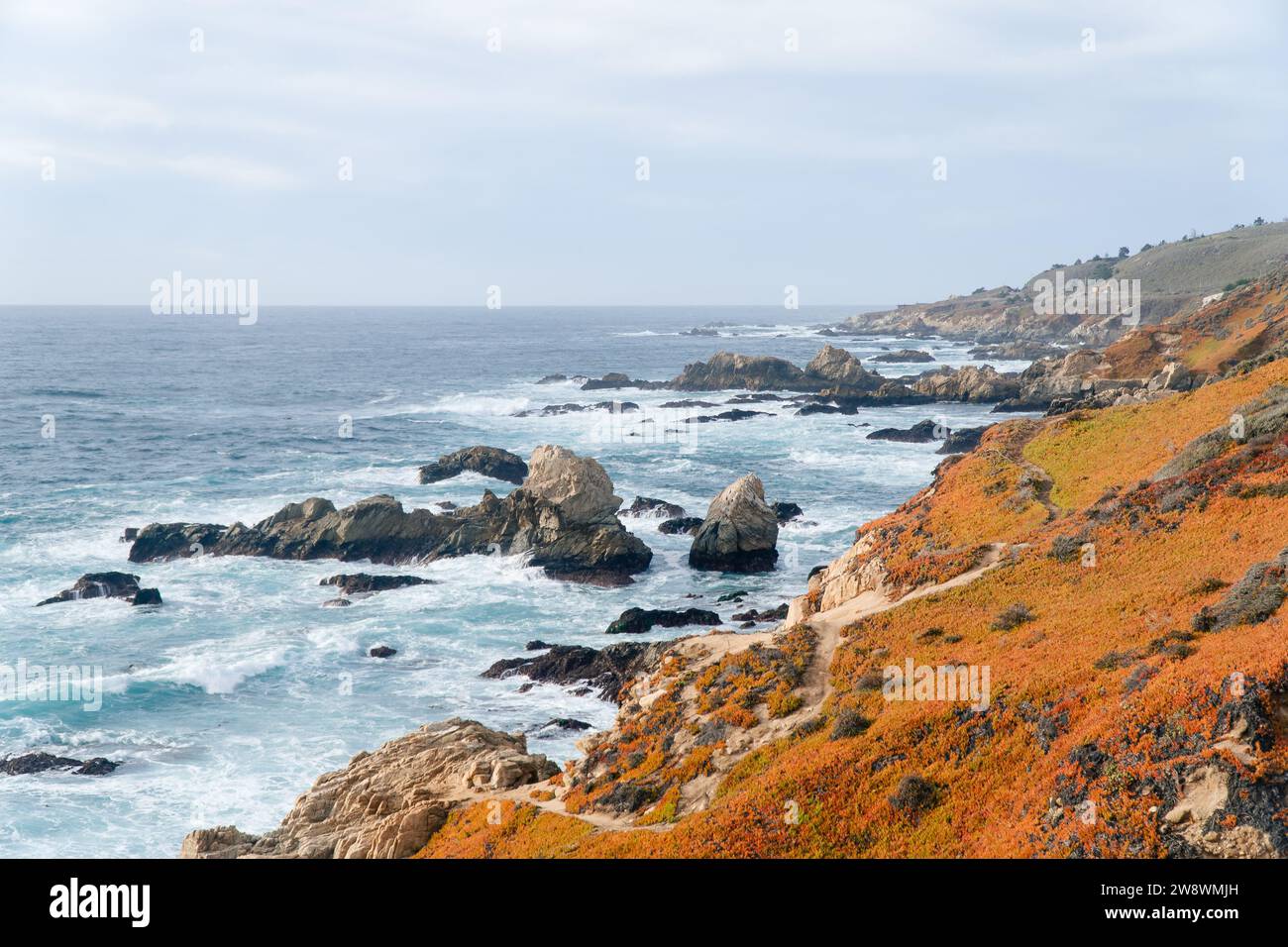 Rocky cliffside of Big Sur with rocky island outcroppings Stock Photo ...