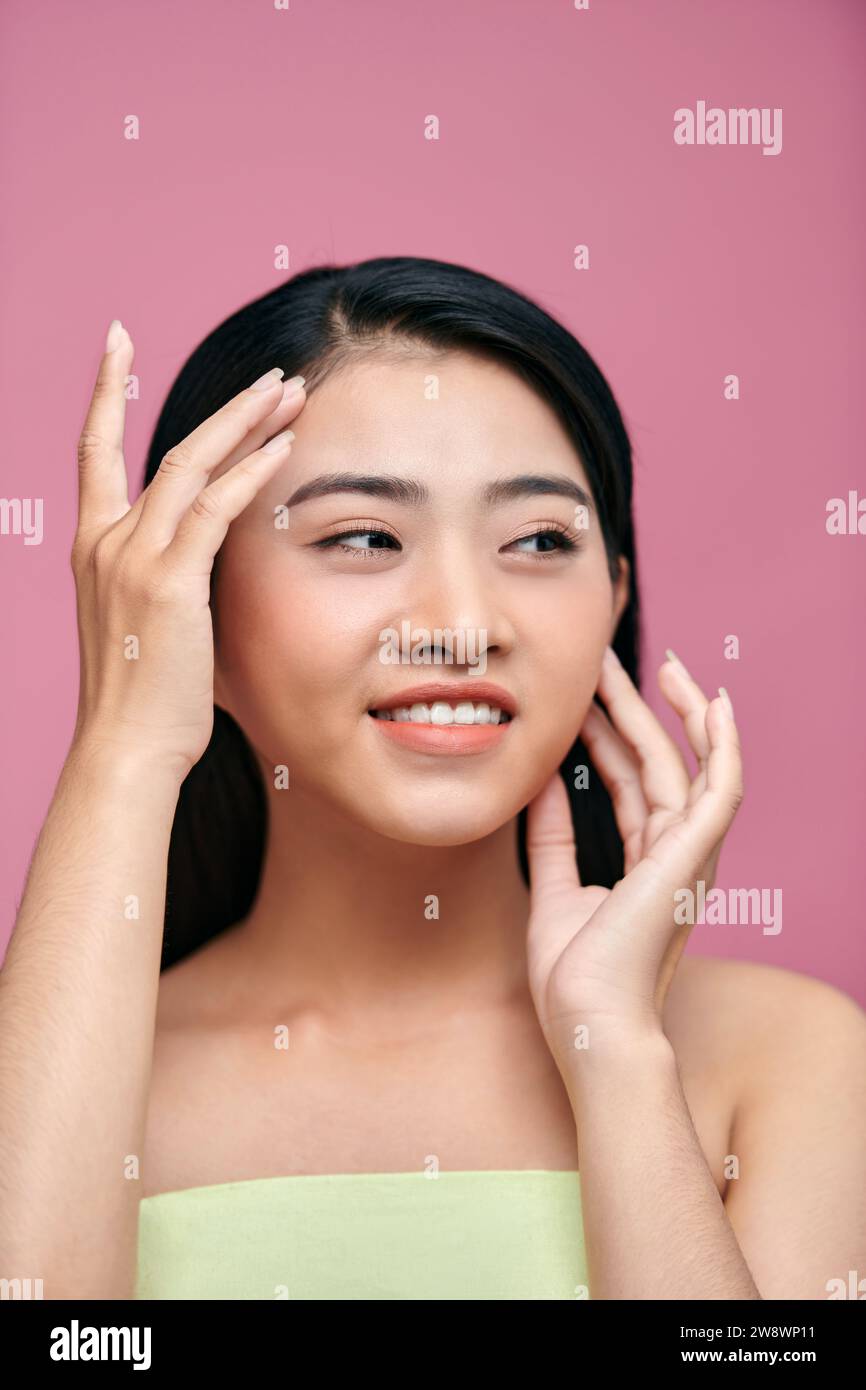 Attractive woman touching clear flawless skin lifting peeling effect ...