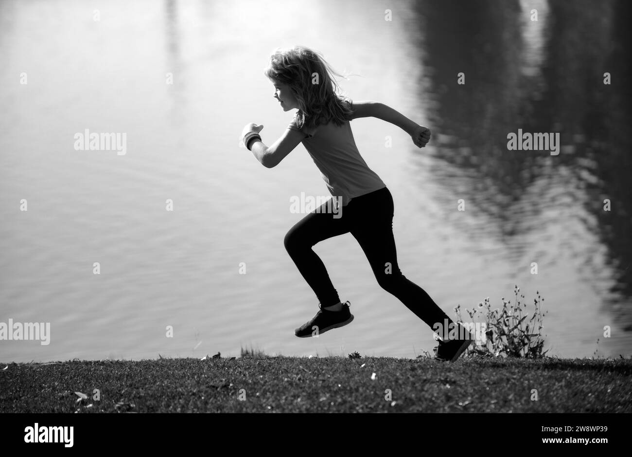 Child boy runners run in park. Sporty young kid jogging and training ...