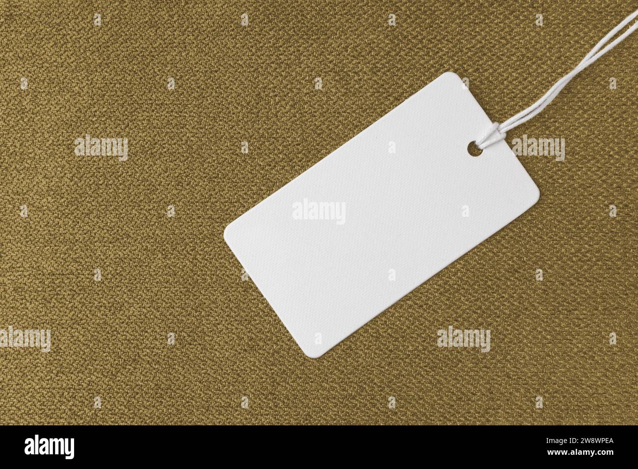 Textile background, yellow coarse fabric texture with white empty ...