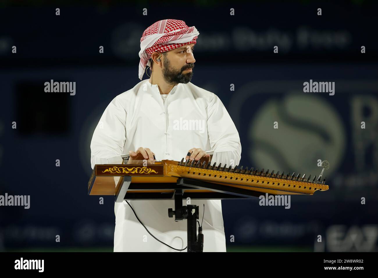 Arab musician plays qunan zither before the trophy presentation of the ...