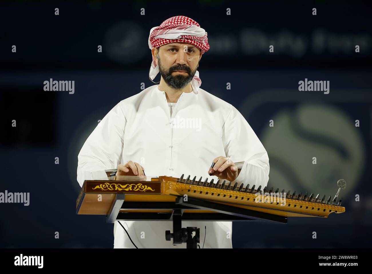 Arab musician plays qunan zither before the trophy presentation of the ...