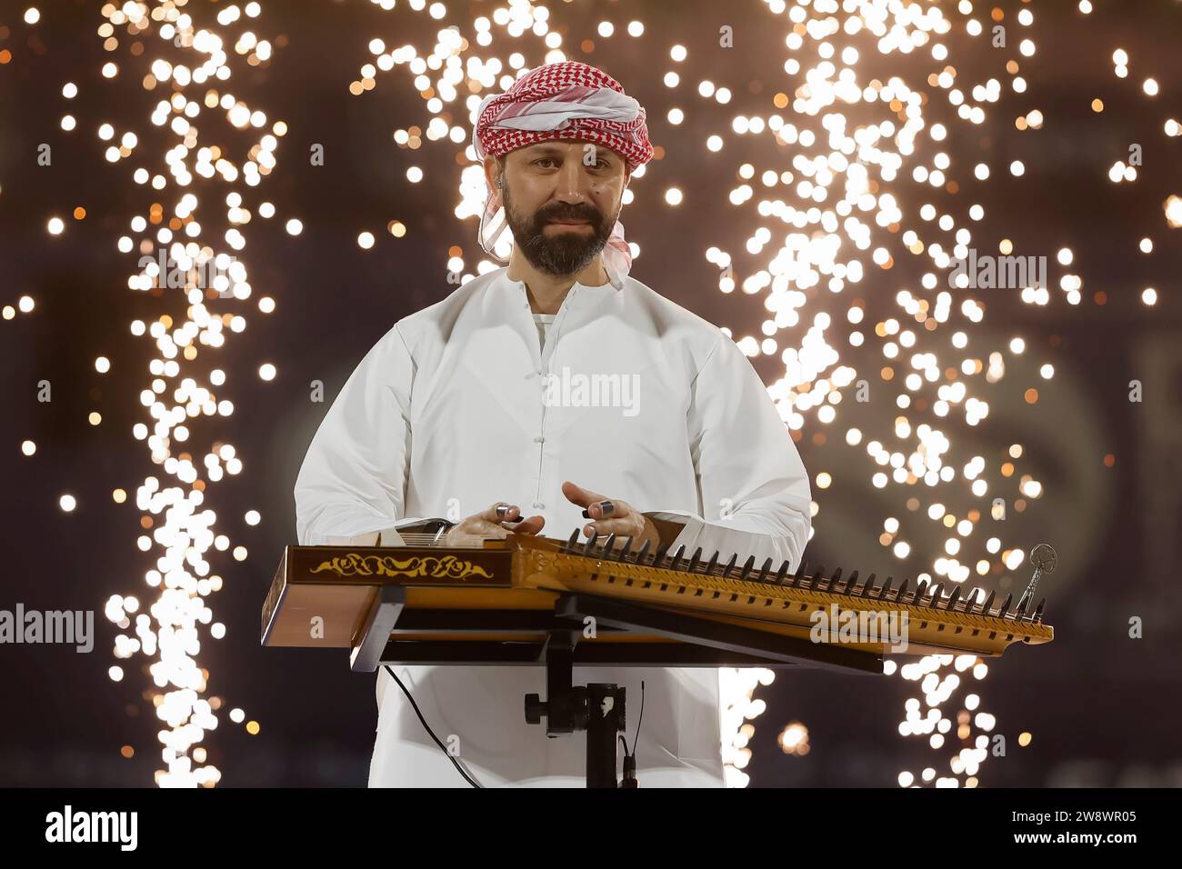 Arab musician plays qunan zither before the trophy presentation of the ...