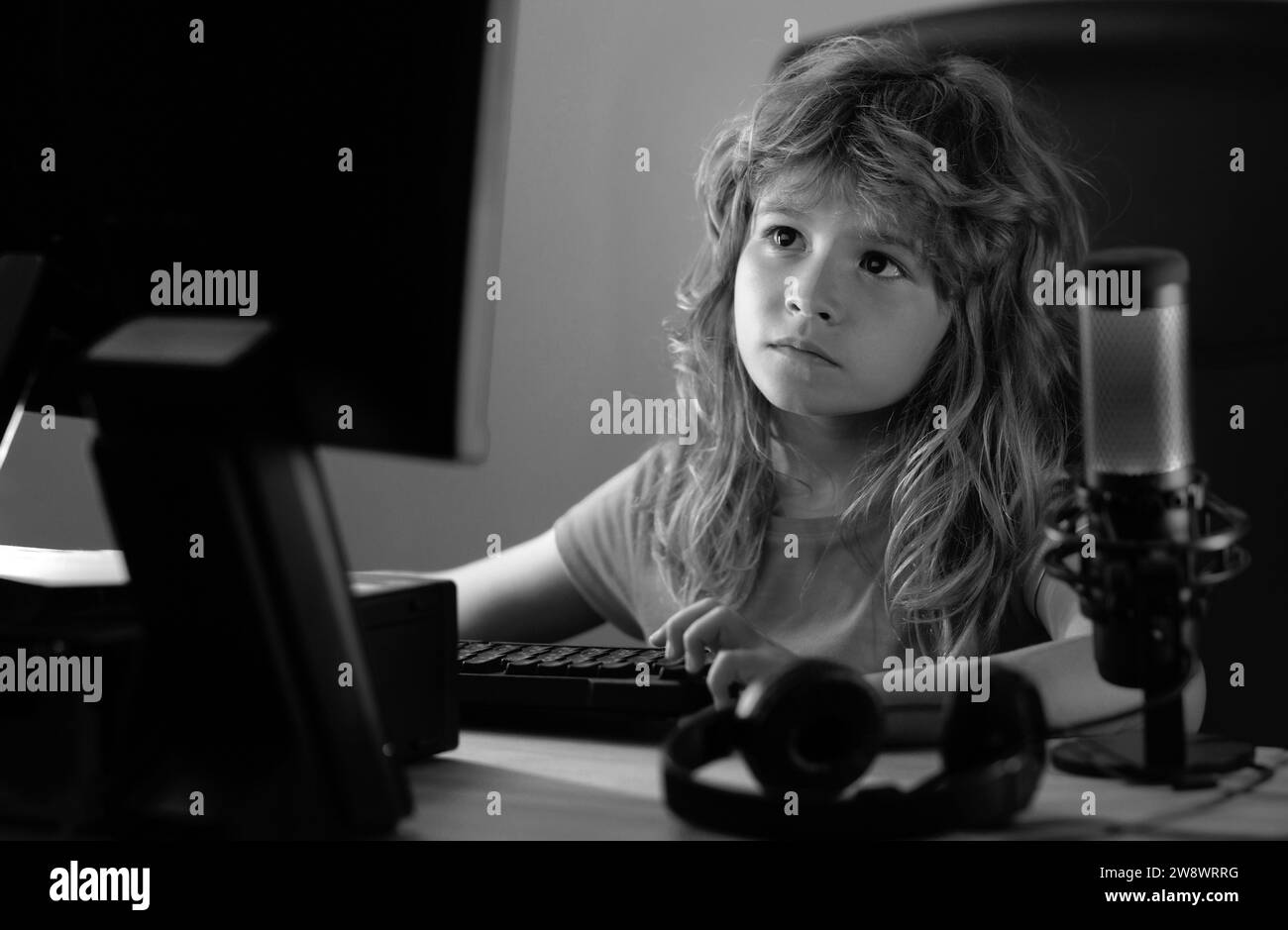 Child learning in virtual online school class. Kid working on laptop ...