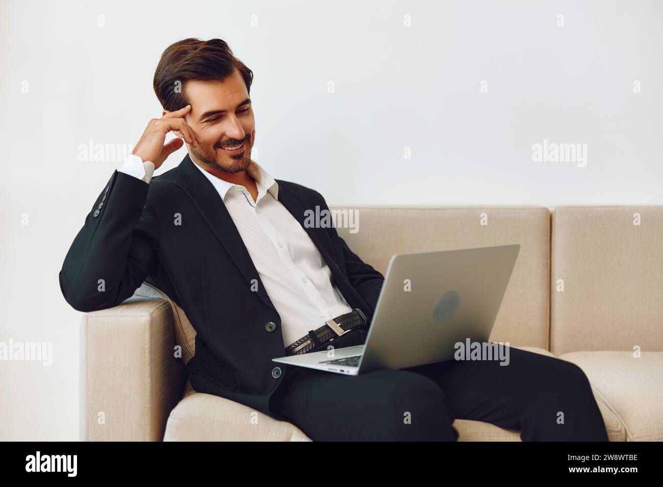 Man working office businessman sofa laptop job sitting Stock Photo - Alamy