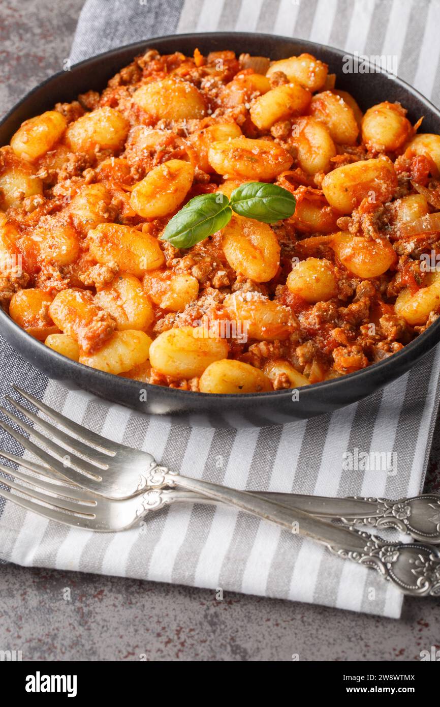 Italian potato gnocchi with bolognese sauce closeup on the plate on the ...