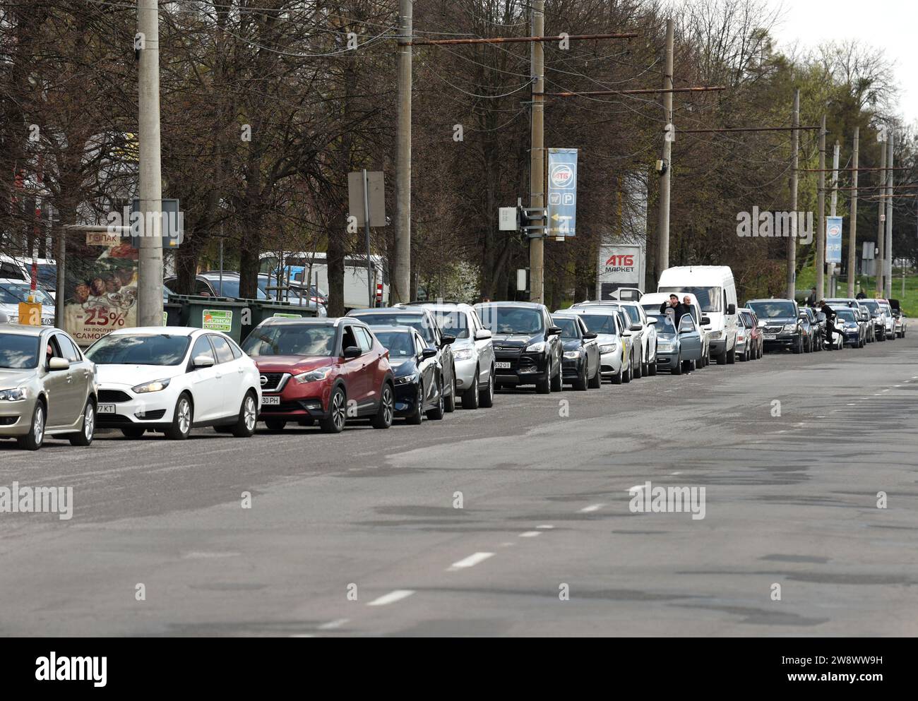 Lviv, Ukraine - April 30, 2022: Cars stay in long queue to a petrol ...