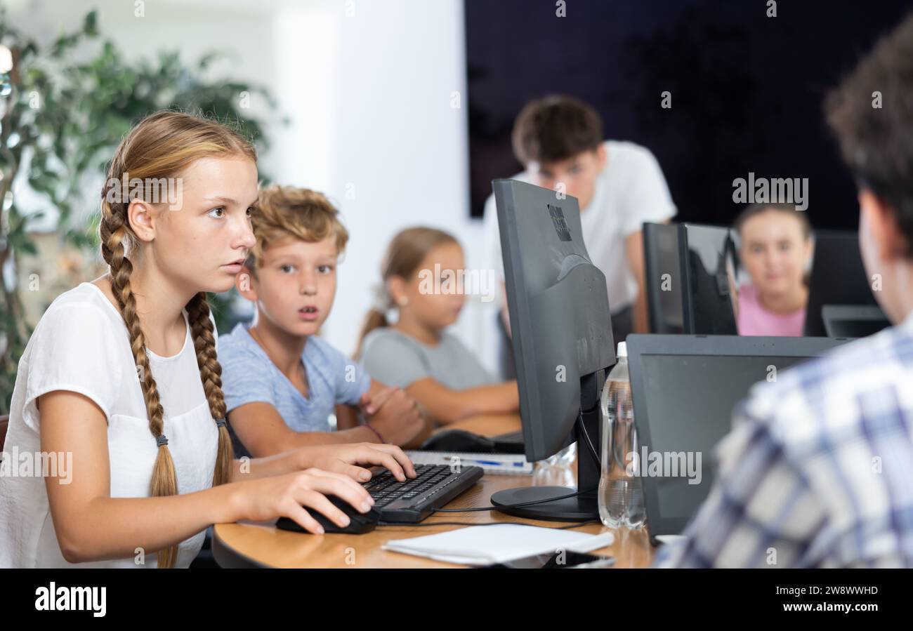 Portrait of female schoolgirl at computers in computer class Stock ...