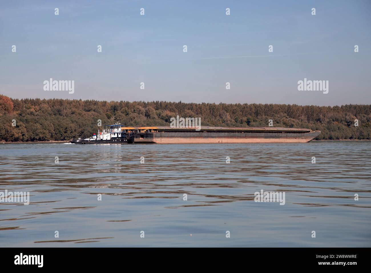 A tugboat pushes two river barges down the Danube River Stock Photo - Alamy