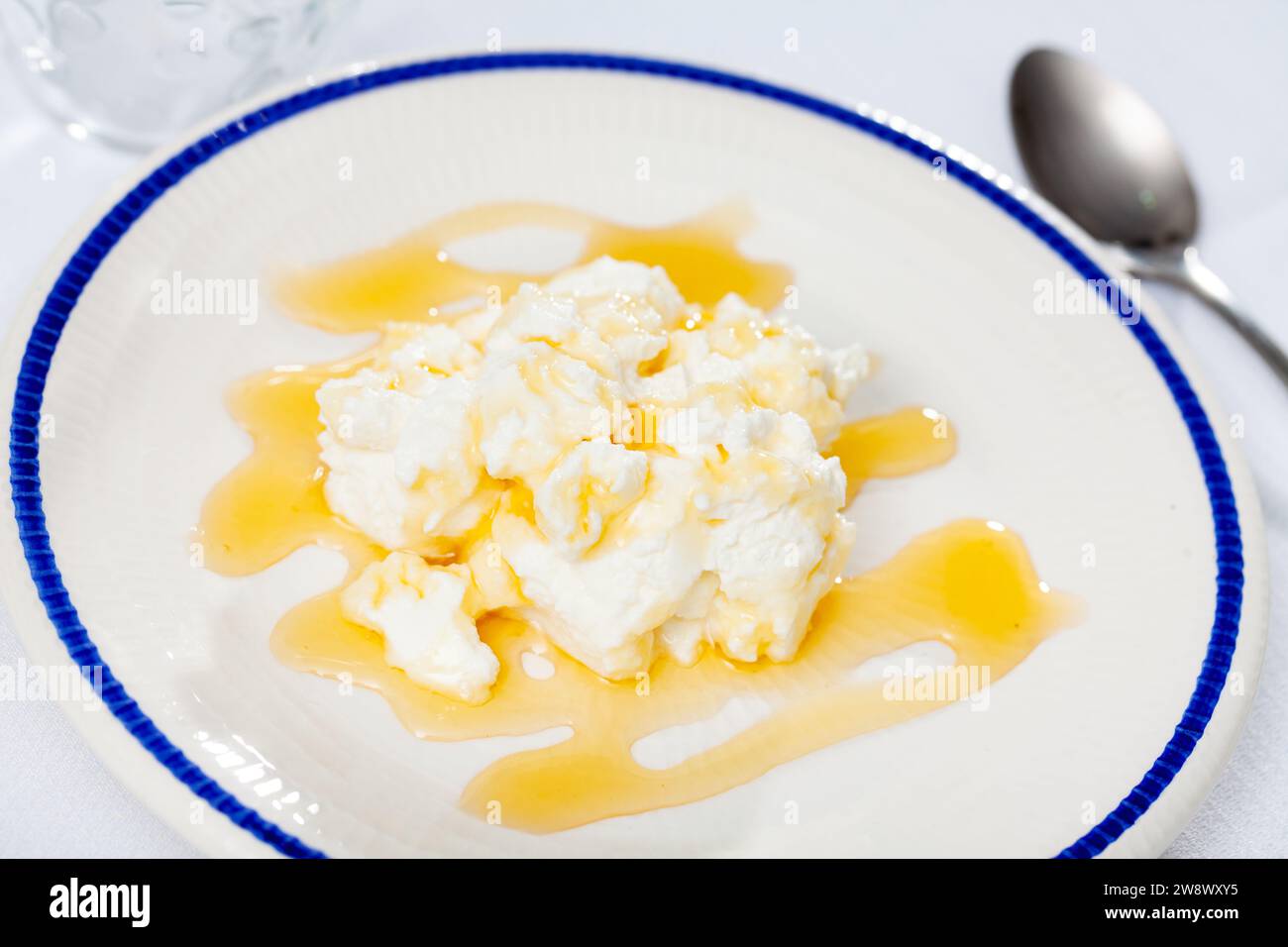 Sheep milk cheese mato with sweet honey Stock Photo - Alamy
