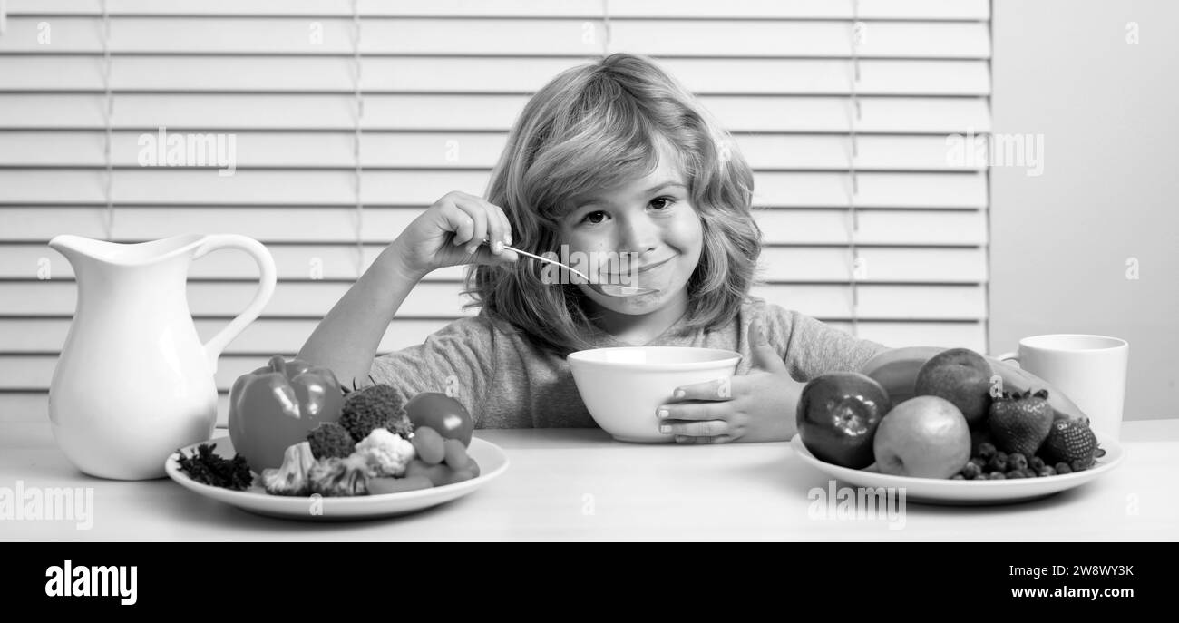 Morning snack with muesli cereal granola. Funny kid boy having ...