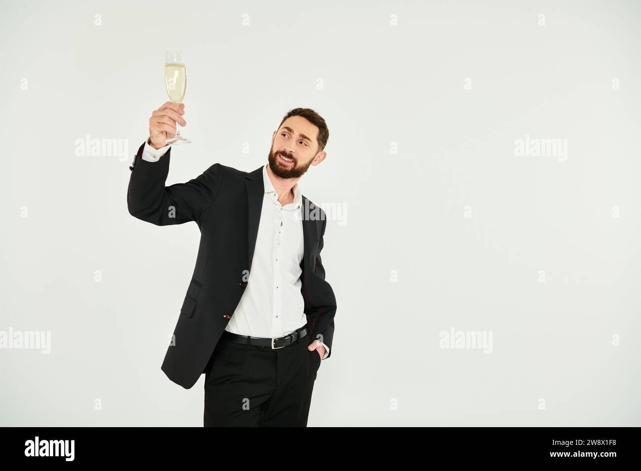 happy successful businessman in black suit toasting with champagne on ...