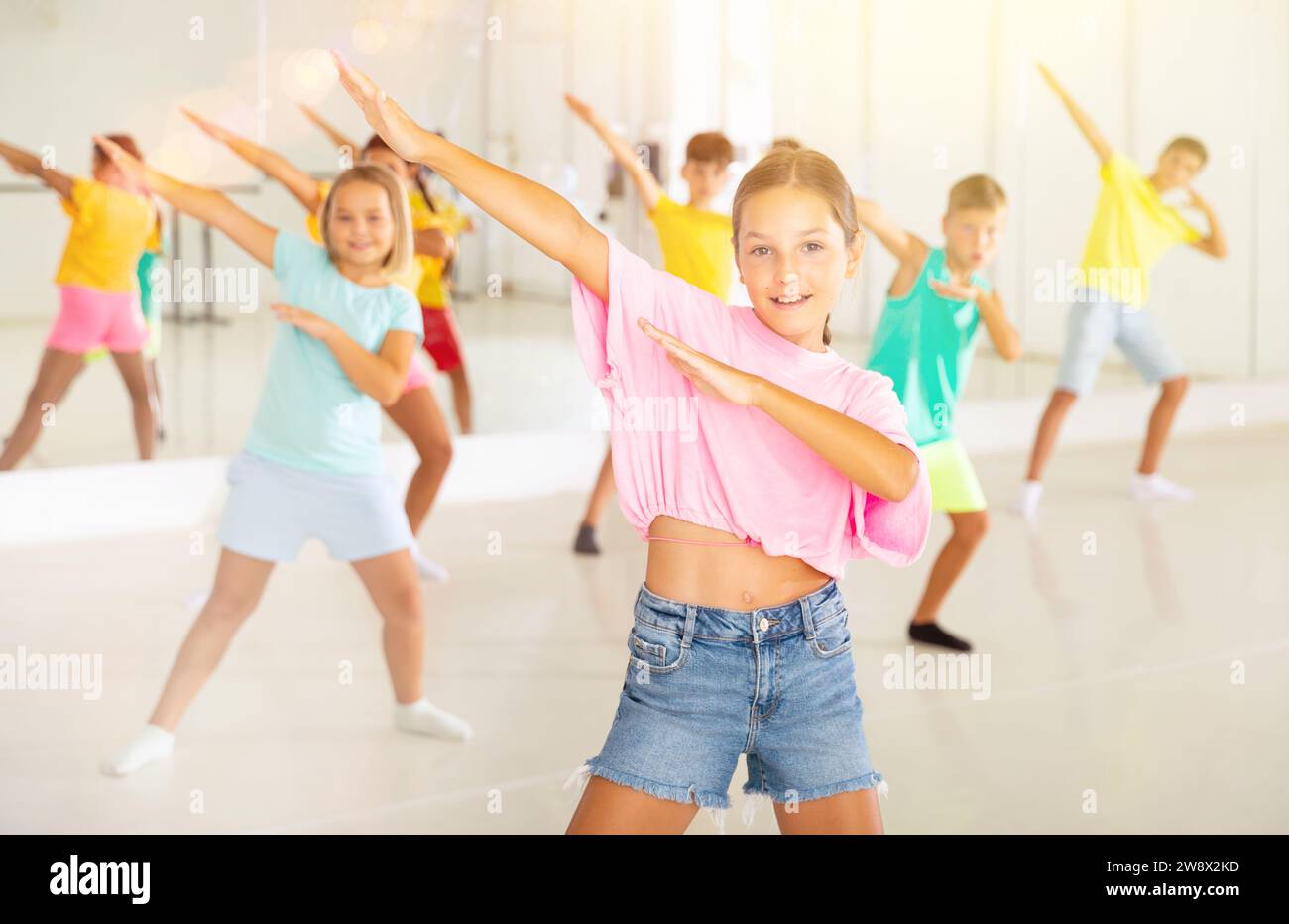 Group of kids training modern dance moves Stock Photo - Alamy