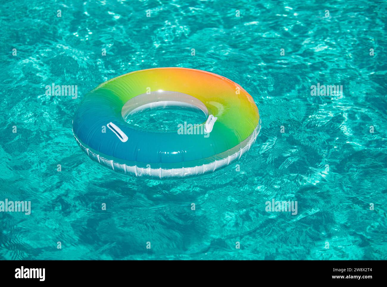 Aqua textured. Pool float, ring floating in a refreshing blue swimming ...