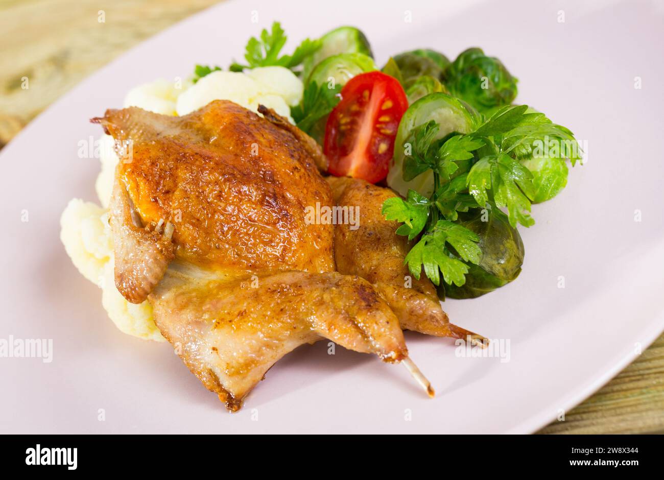Grilled partridge with steamed vegetables Stock Photo - Alamy