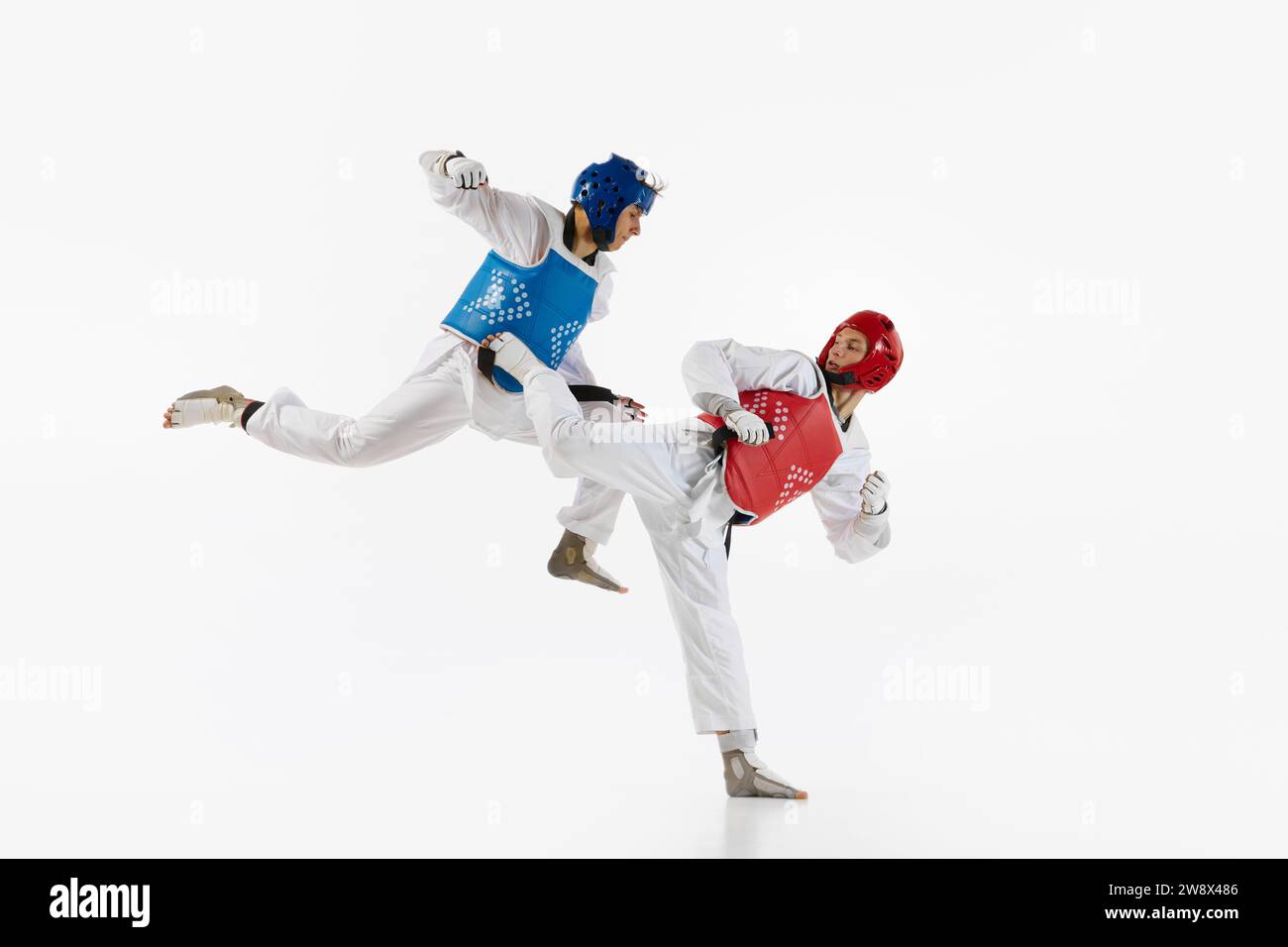 Competitive strong young men, taekwondo, karate athletes in motion ...