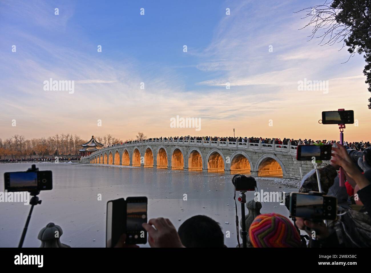 Beijing, China. 22nd Dec, 2023. Visitors take pictures of the Seventeen ...