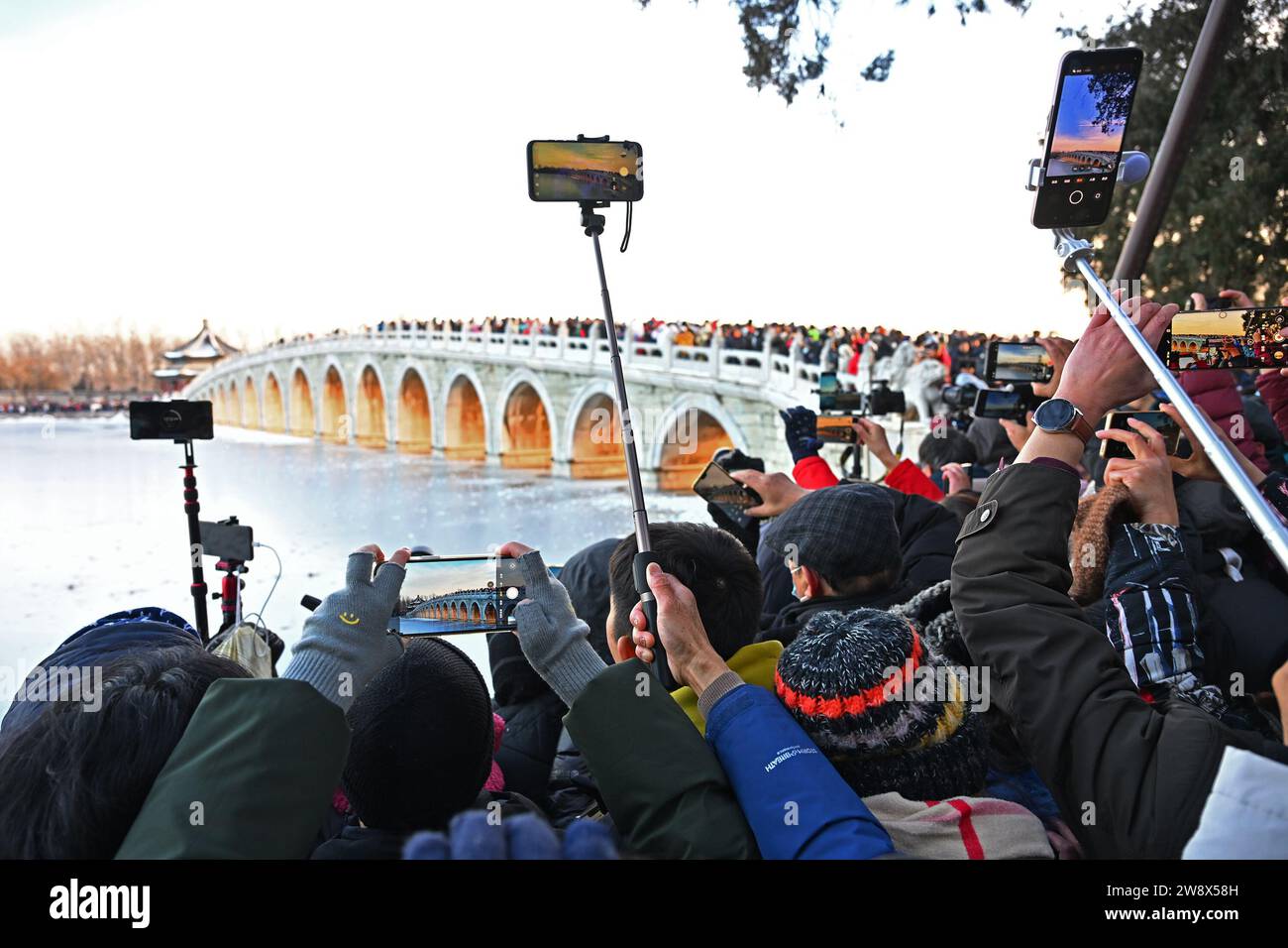 Beijing, China. 22nd Dec, 2023. Visitors take pictures of the Seventeen ...