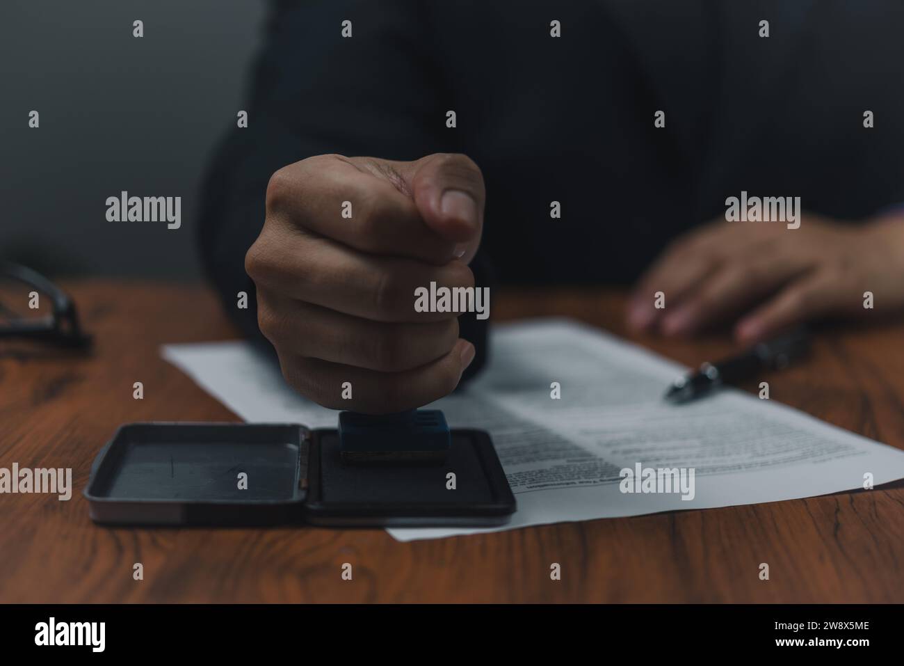 Hand man stamping documents notary public in office . Businessperson ...