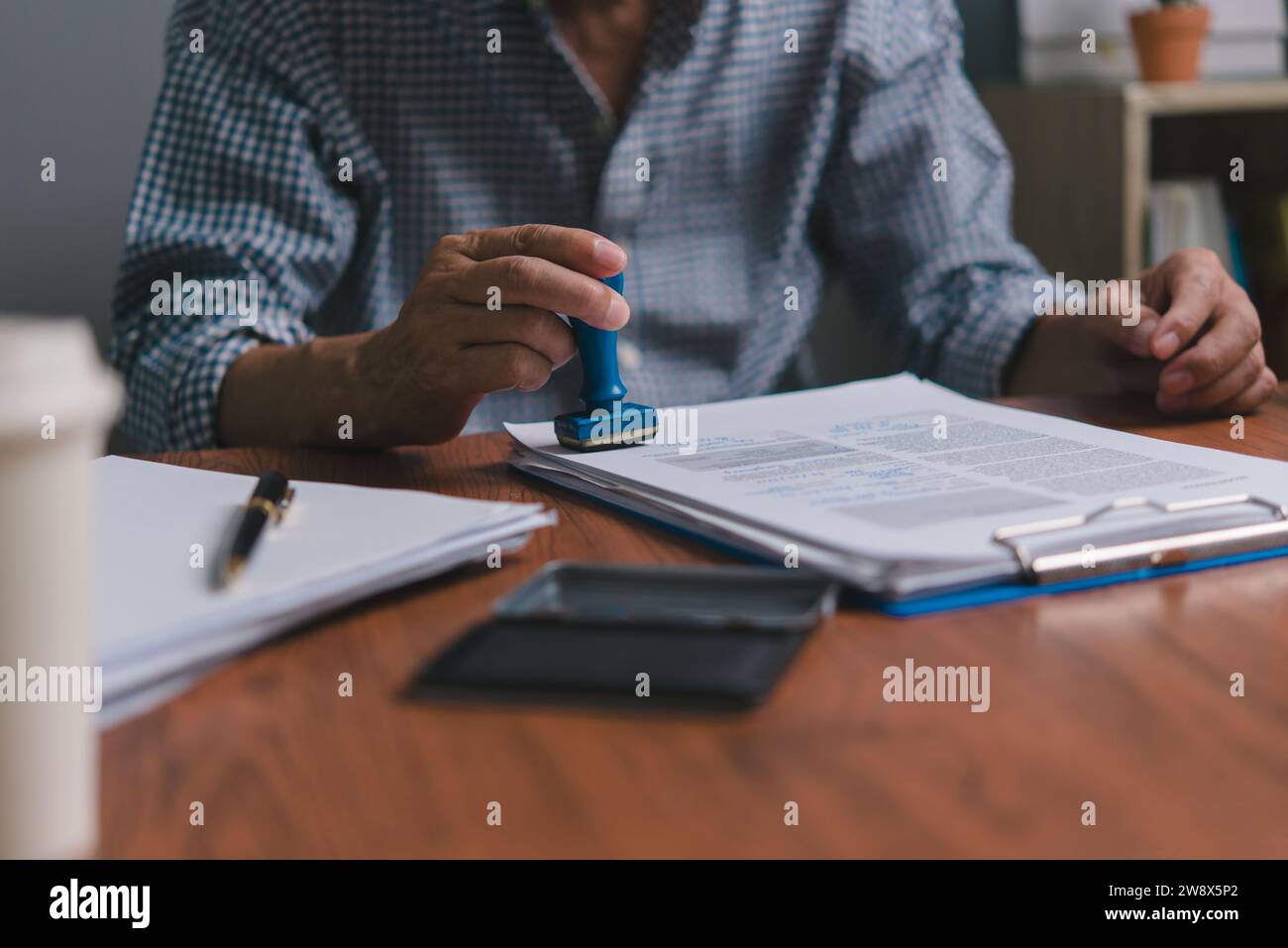 Hand man stamping documents notary public in office . Businessperson ...