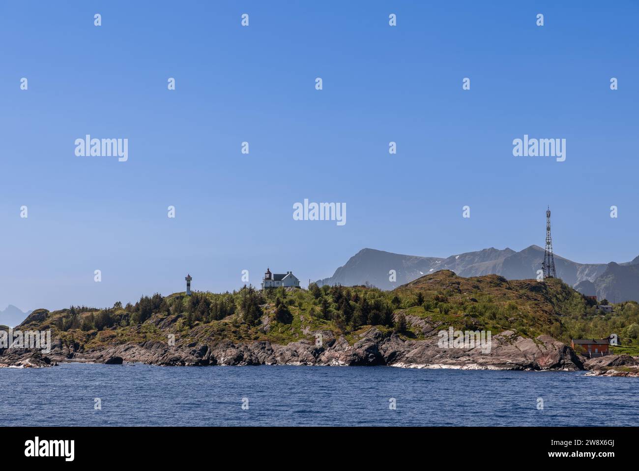 View of the North Sea and mountain range rising above peaceful waters ...