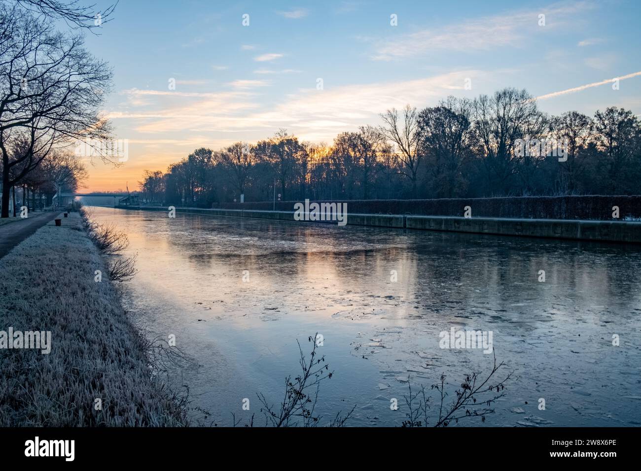 A tranquil early morning scene where a gentle sunrise graces the sky ...