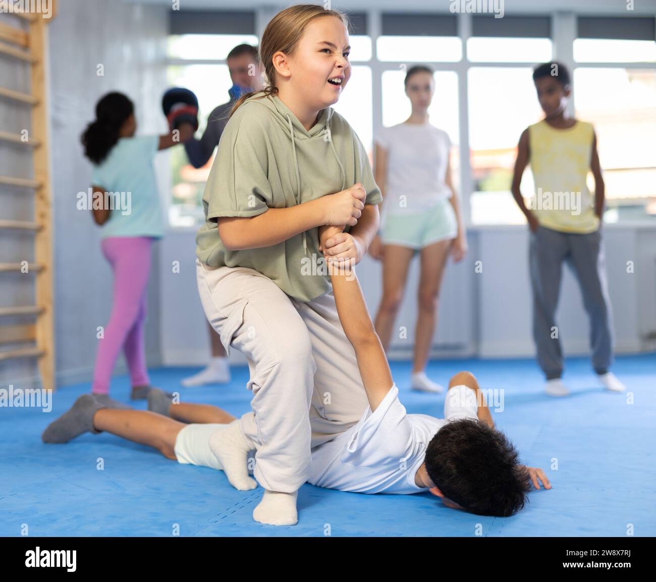 Boy and girl practicing self-defense techniques Stock Photo - Alamy