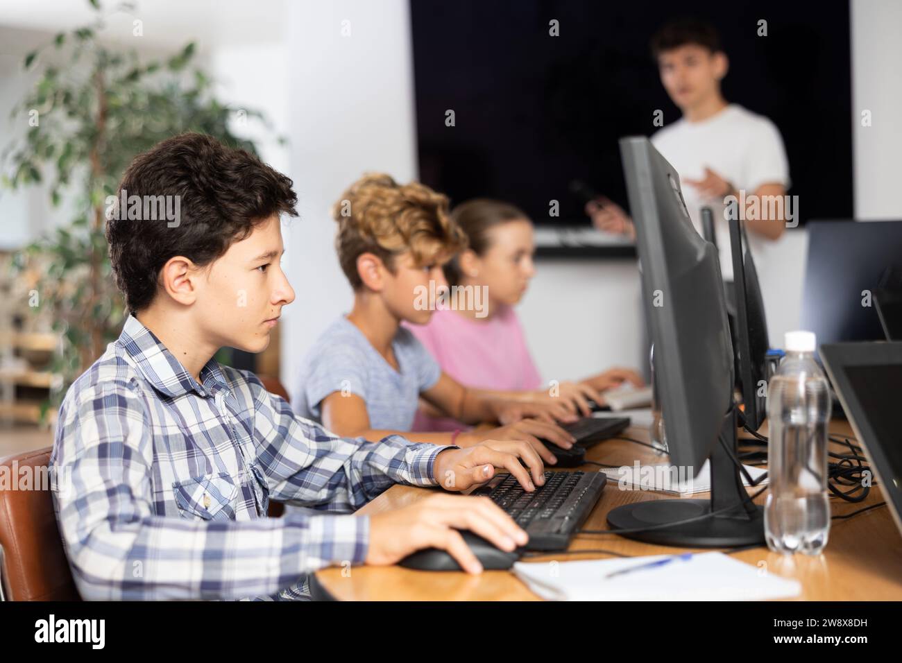 Teacher solving problems with students hi-res stock photography and ...