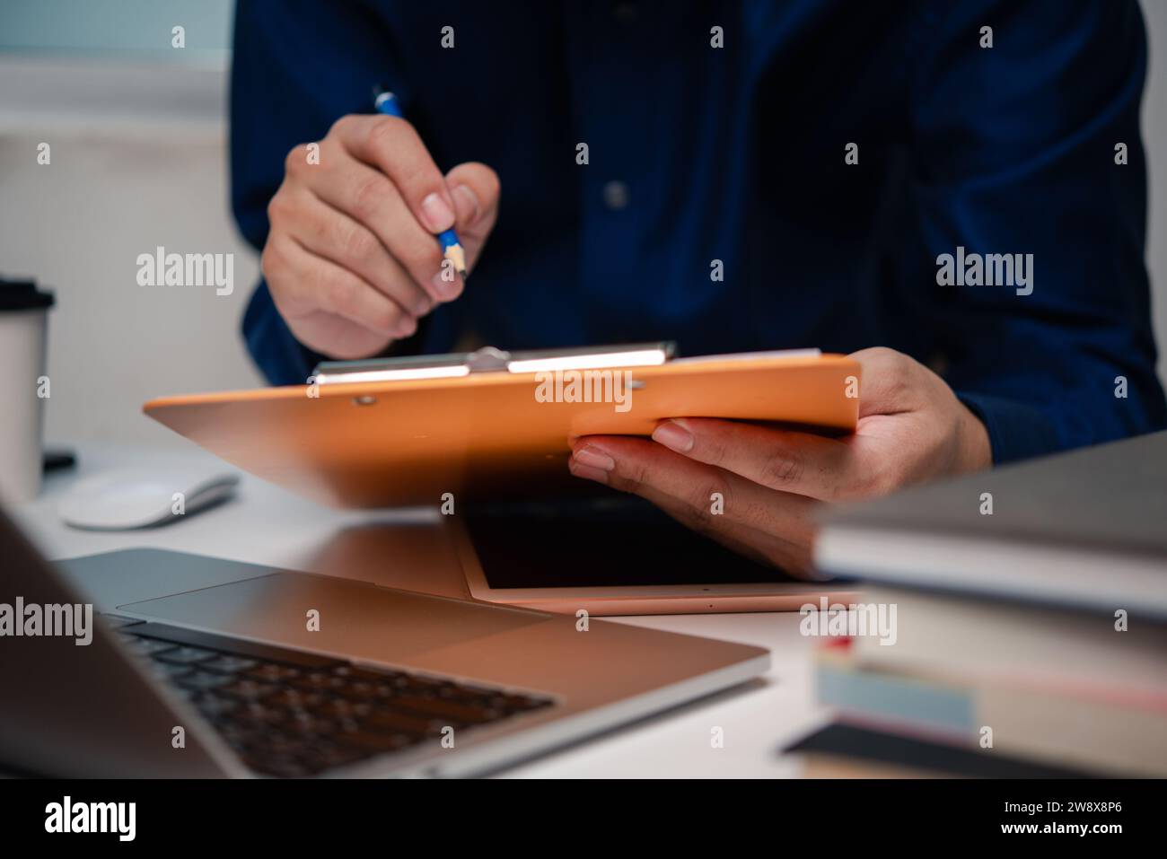 man holding clipboard with checklist employee workplace is reviewing ...