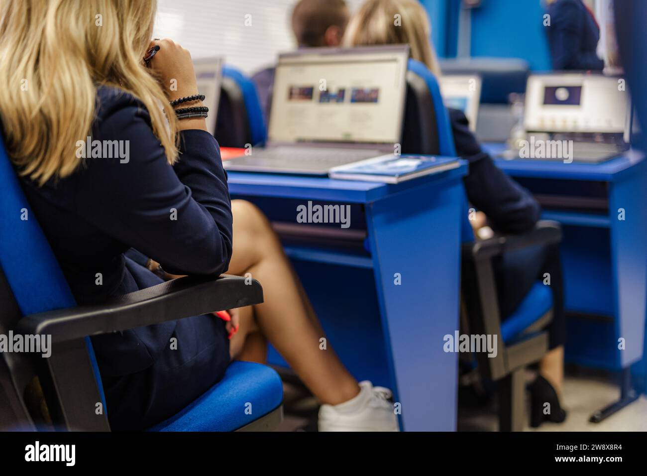 College students attending classes, sitting at classroom Stock Photo ...