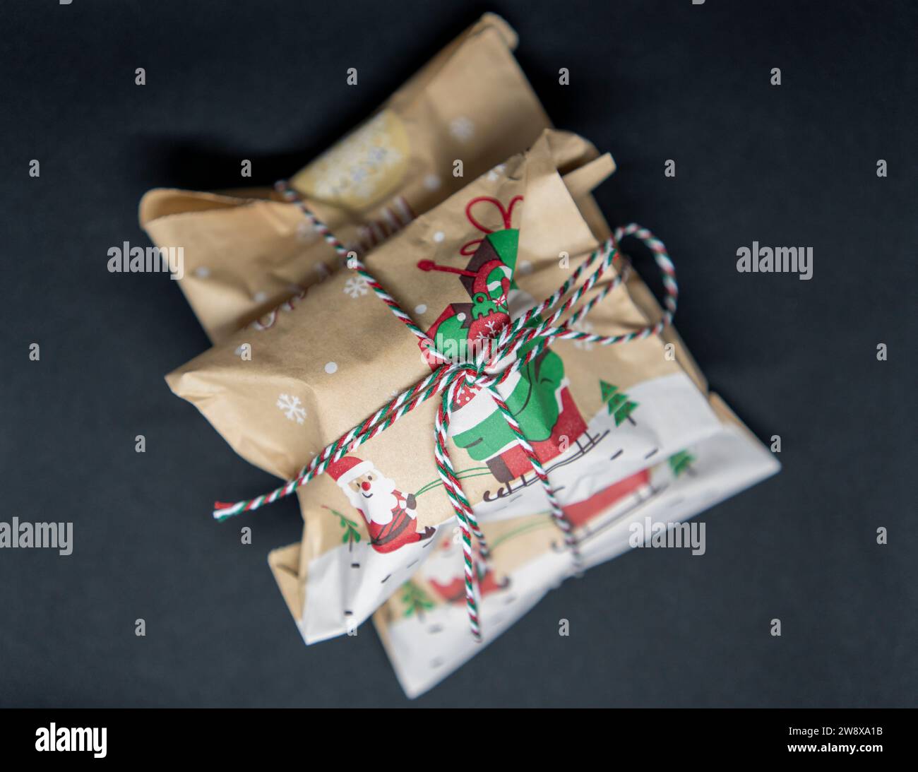 Christmas present wrapped and tied close-up Stock Photo - Alamy