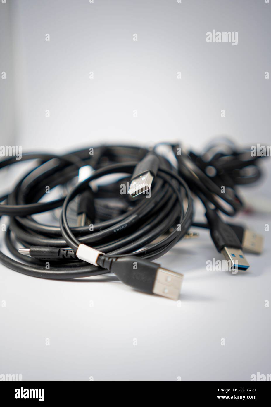 Usb cables tangled together in a messy pile Stock Photo - Alamy