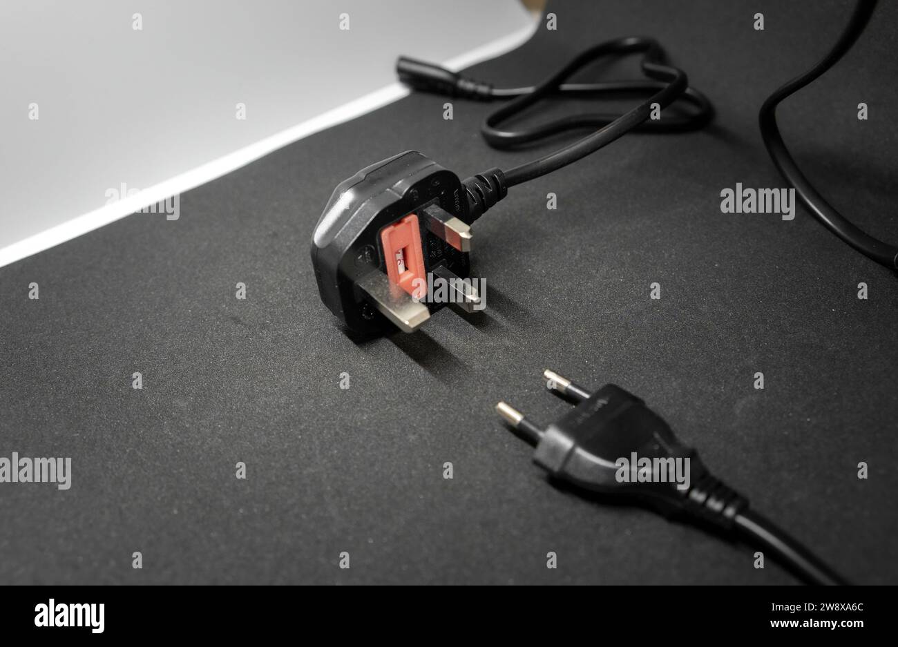 American power plug next to European Stock Photo - Alamy