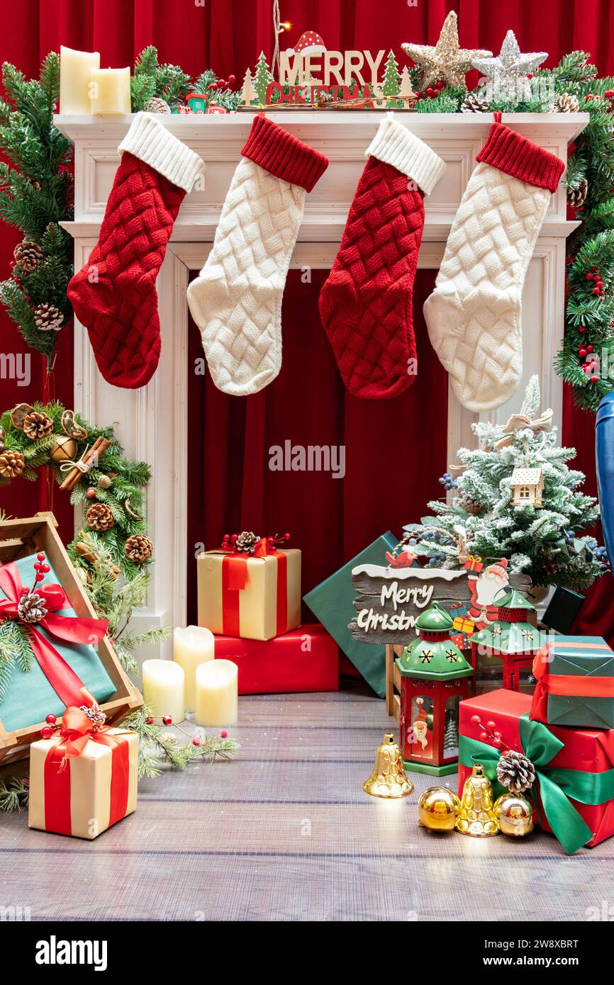 Christmas stockings and present boxes and decorations at vertical ...