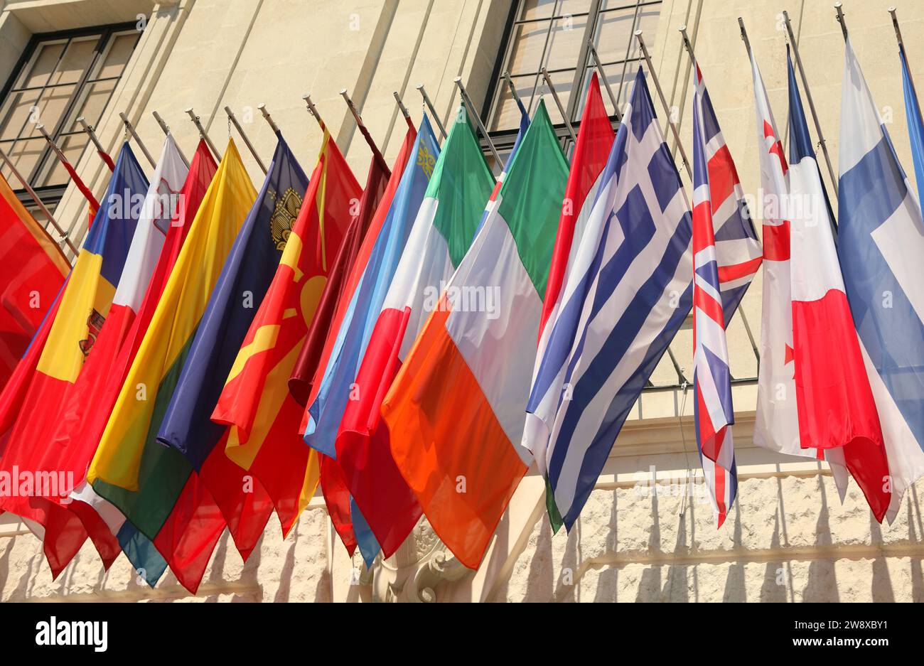 colorful lots of flags of many world nations hanging during the ...