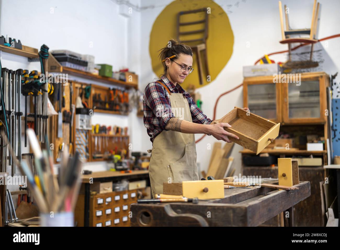 Female carpenter chair hi-res stock photography and images - Alamy