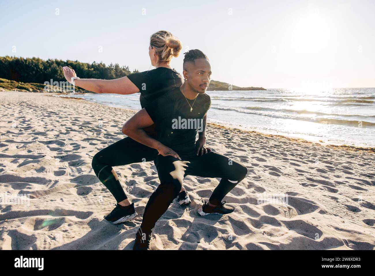 Two young women exercising beach hi-res stock photography and images ...