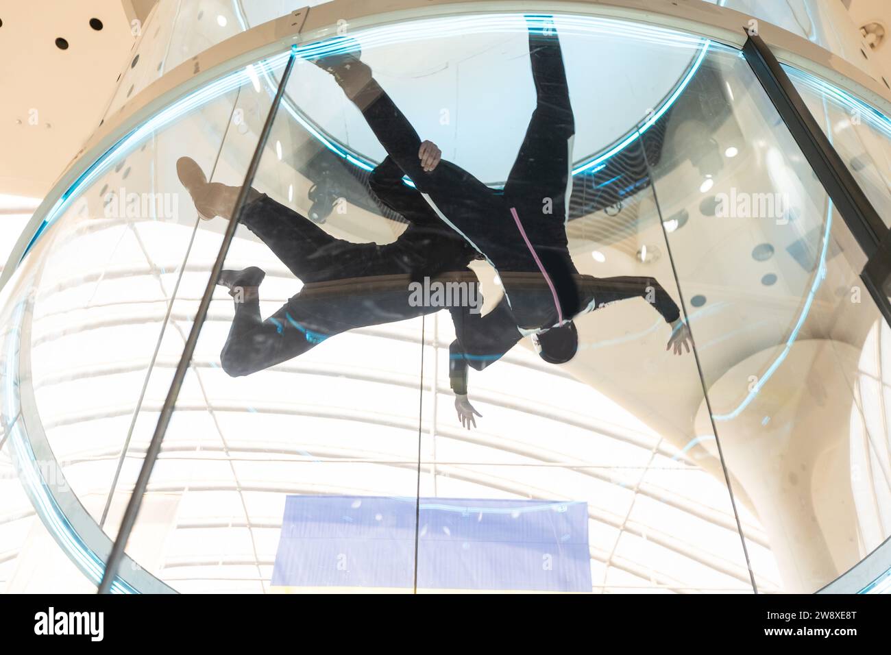 Indoor. Man fly in wind tunnel. Indoor skydiving. New fly sport Stock ...