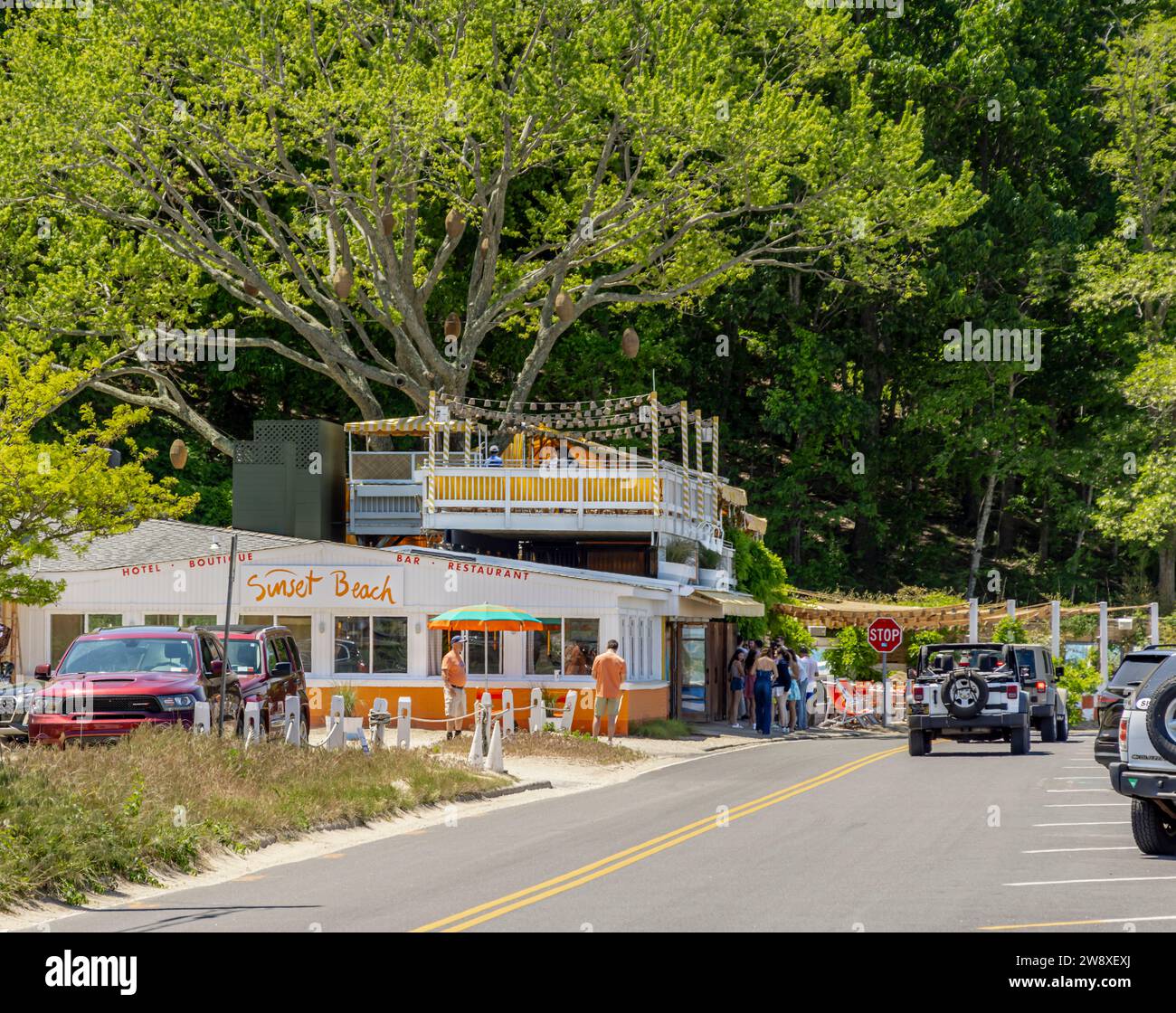 exterior image of a busy sunset beach Stock Photo - Alamy