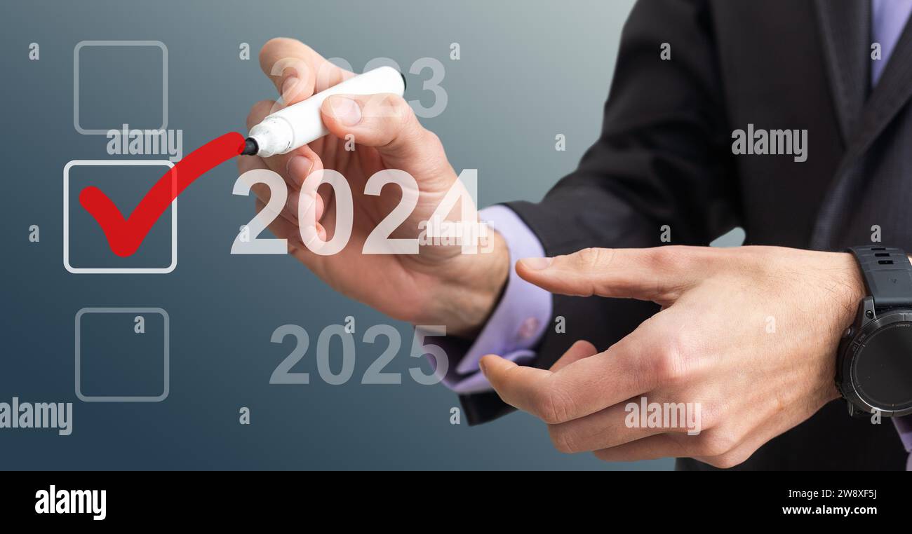 man hand touching on 2024 calender year button on digital virtual ...