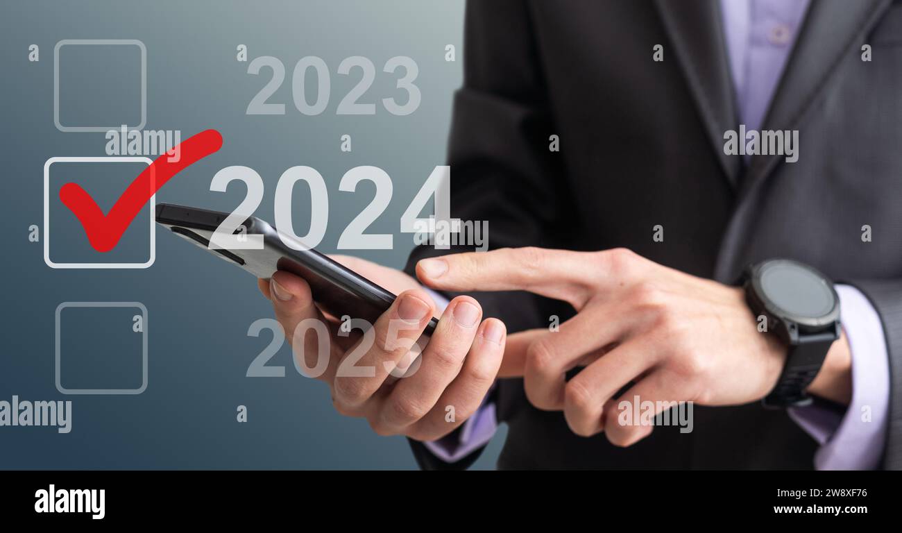 Businessman pressing virtual button New 2024 Year Stock Photo - Alamy