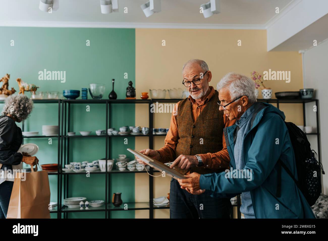 Senior male owner showing hi-res stock photography and images - Alamy