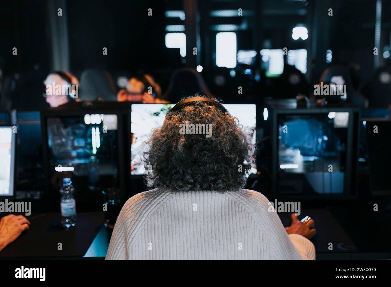 Asian playing computer game rear view hi-res stock photography and ...